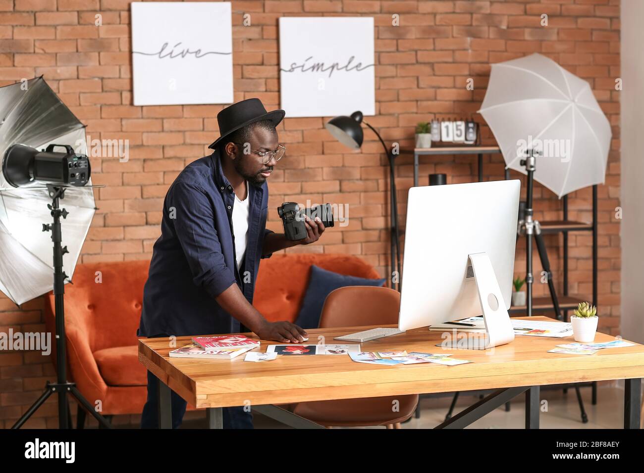 African-American photographer in modern studio Stock Photo - Alamy