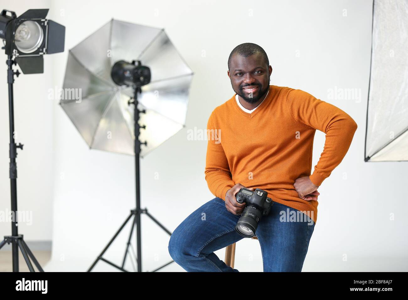 African-American photographer in modern studio Stock Photo - Alamy
