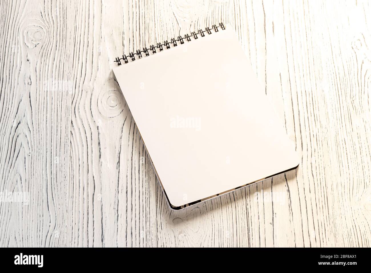 The notebook on a white table with a copy space. Template for mock up ...