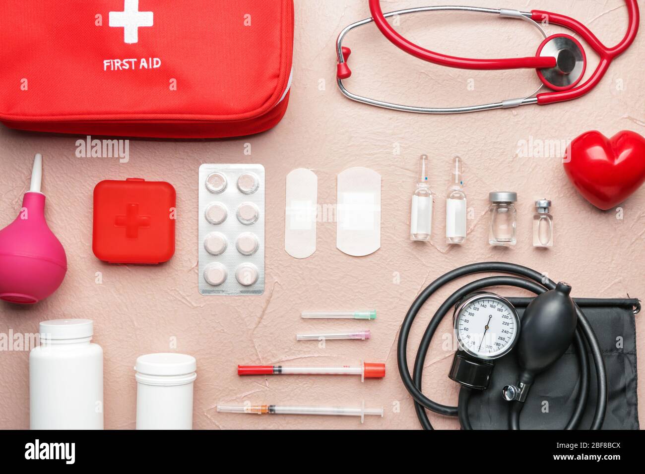 First aid kit on color background Stock Photo - Alamy