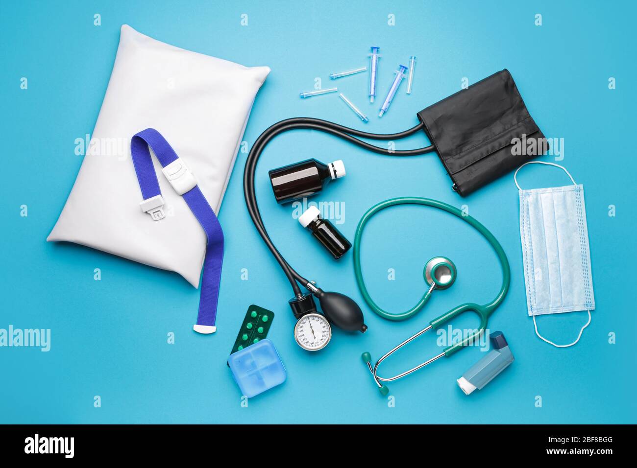 First aid kit on color background Stock Photo - Alamy