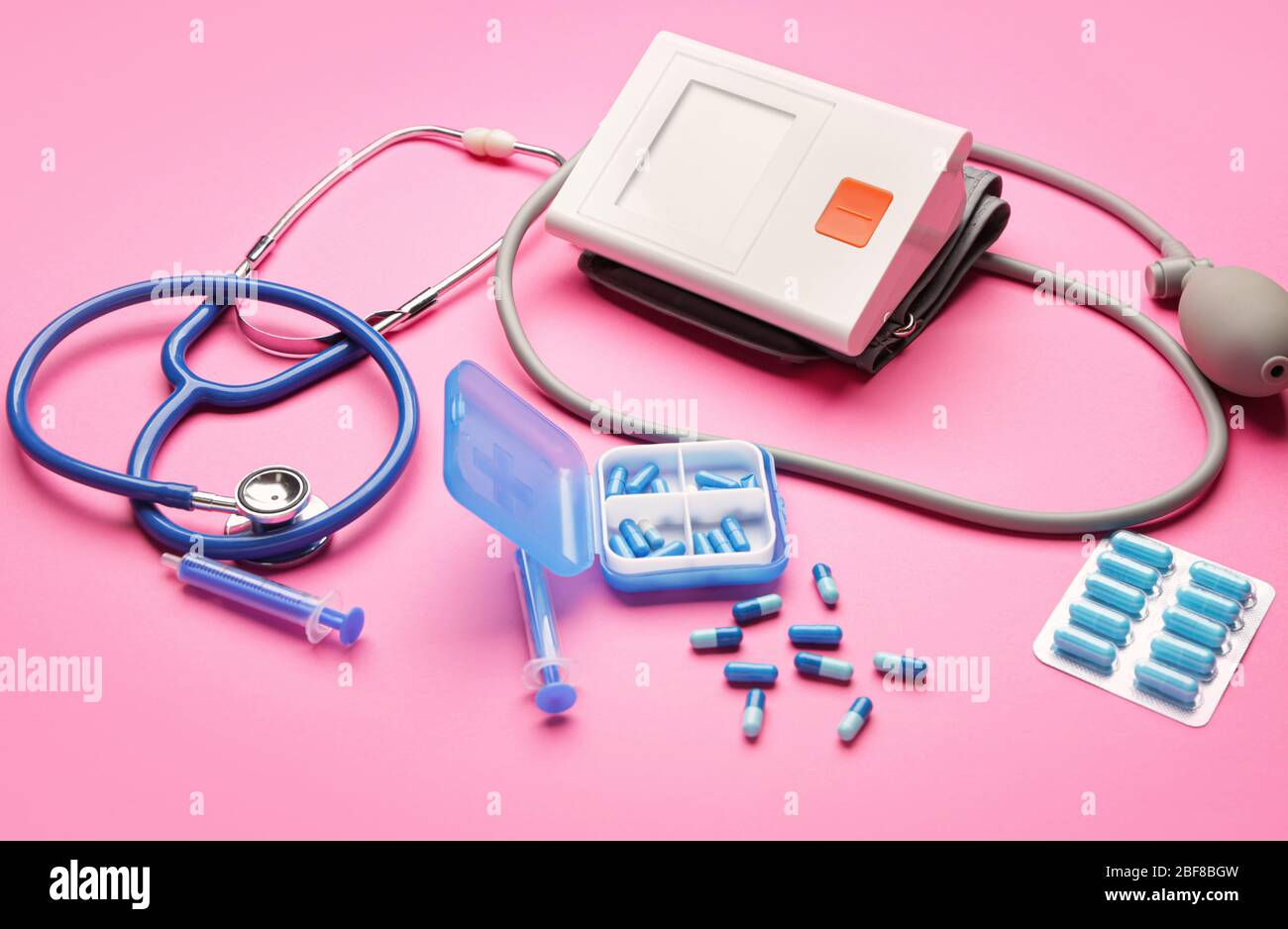 First aid kit on color background Stock Photo - Alamy