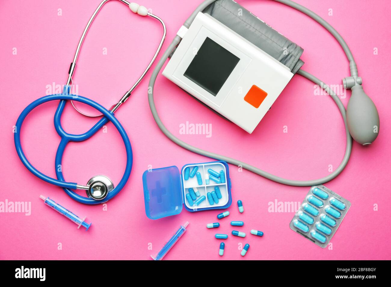 First aid kit on color background Stock Photo - Alamy