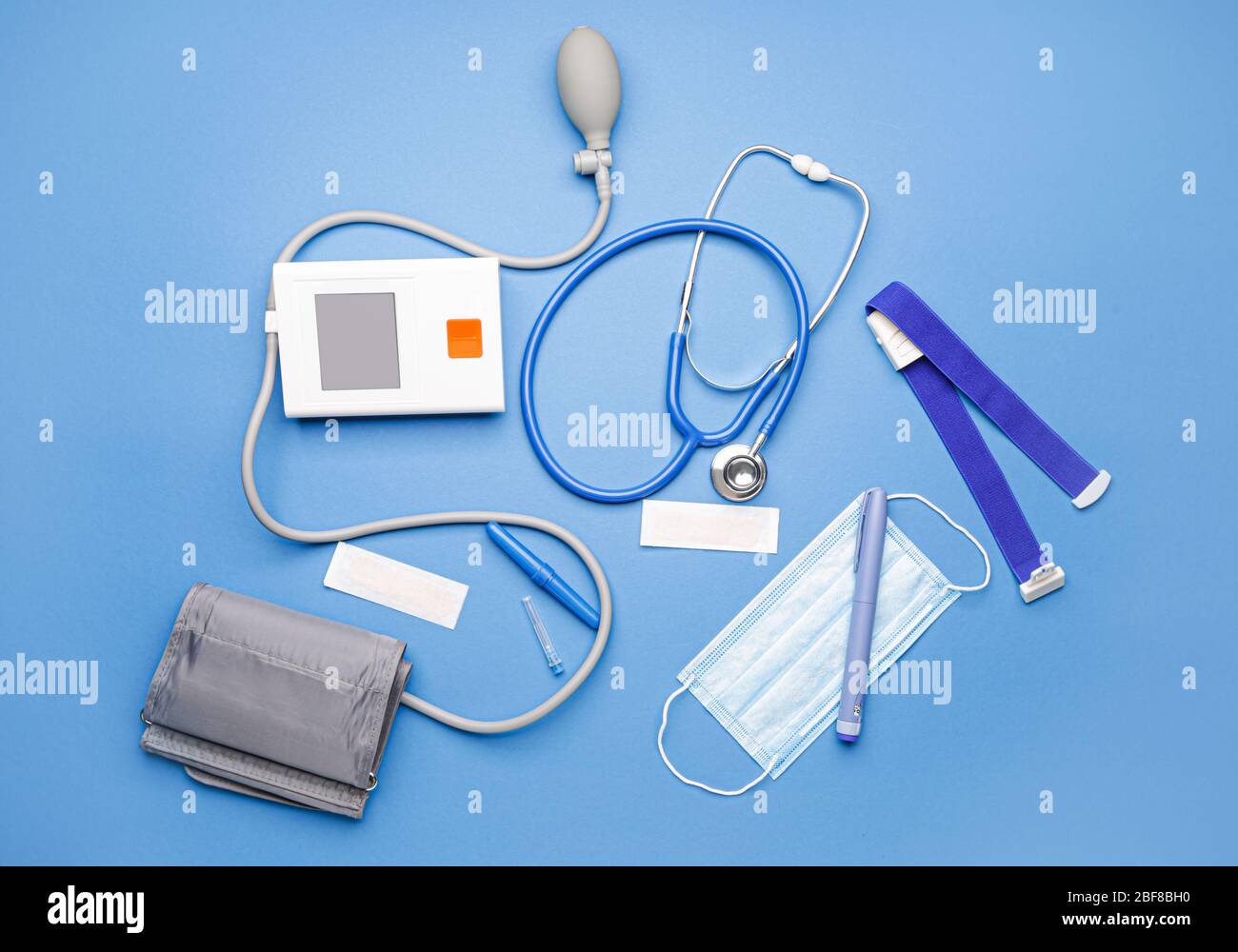 First aid kit on color background Stock Photo - Alamy