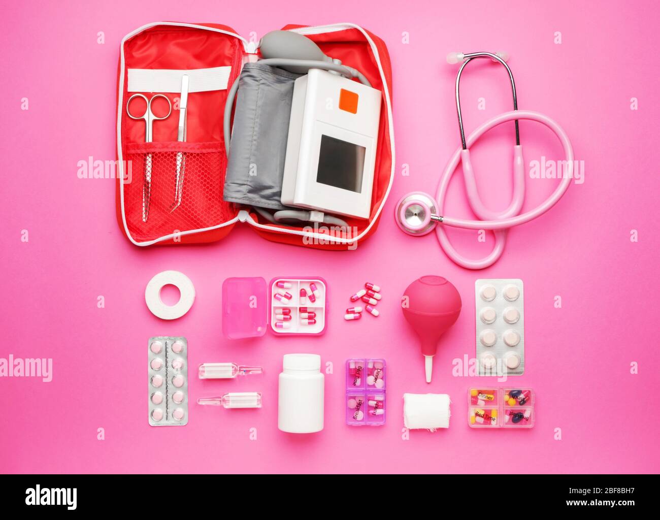 First aid kit on color background Stock Photo - Alamy