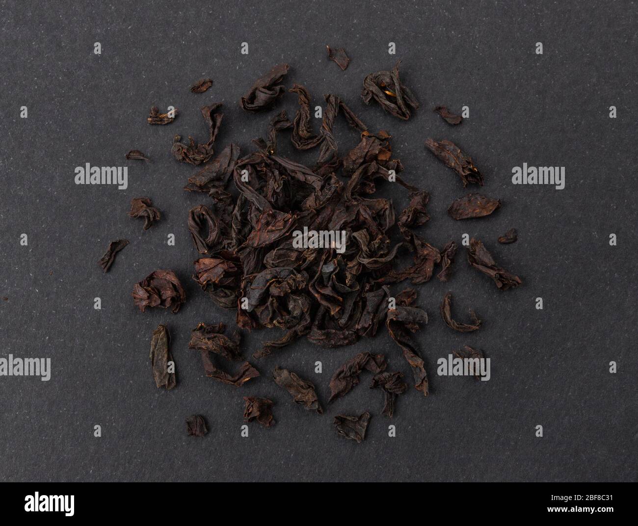 Dry black tea leaves isolated on white background, top view Stock Photo ...