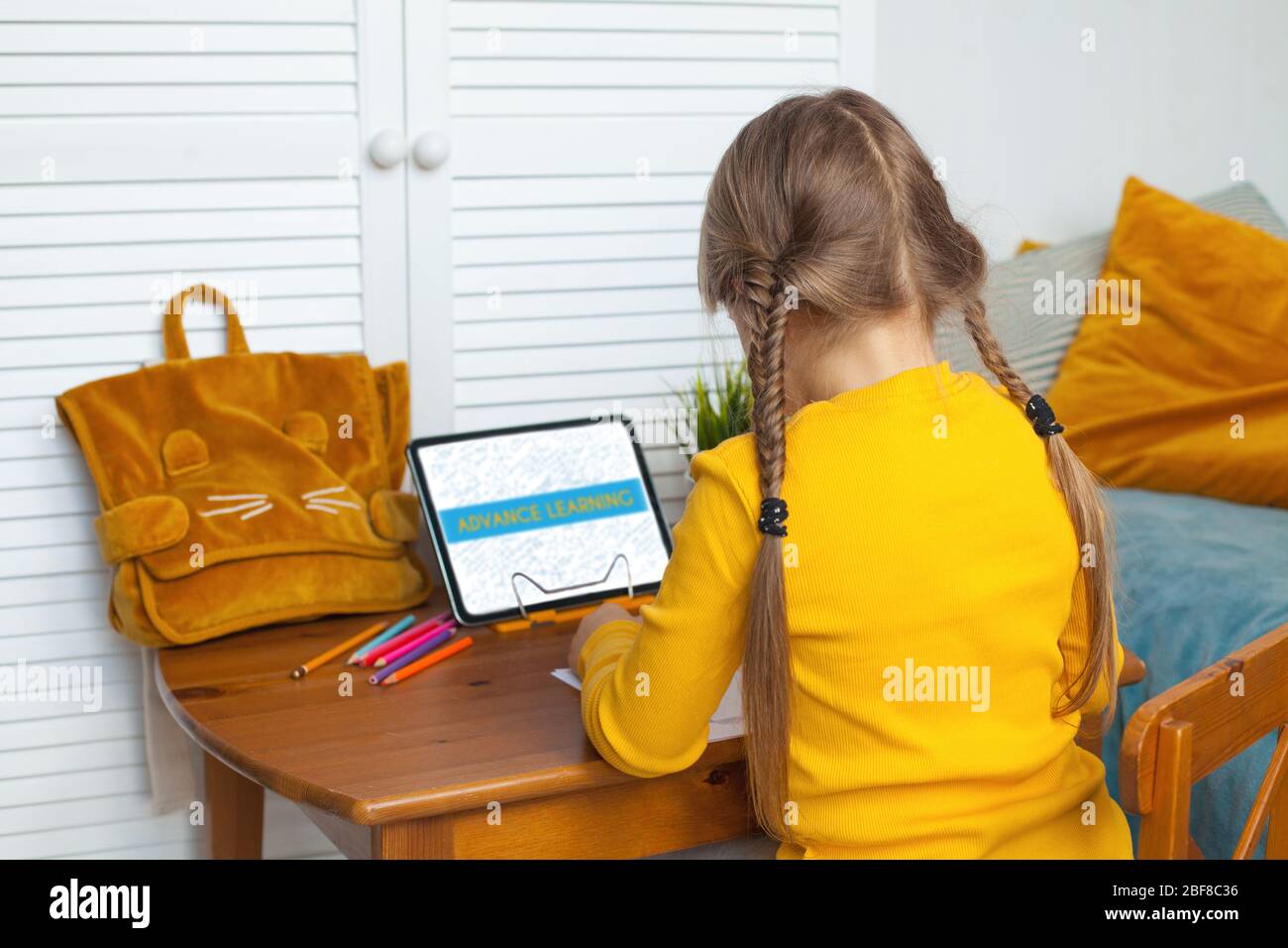 Child using tablet at home Stock Photo - Alamy
