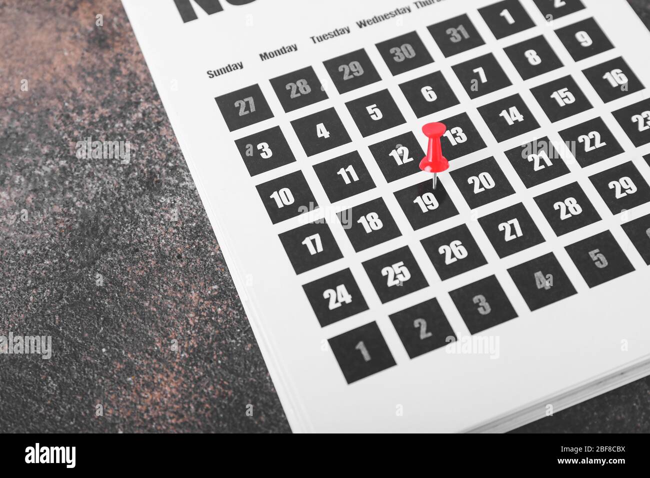 Calendar with marked date on table. Deadline concept Stock Photo - Alamy