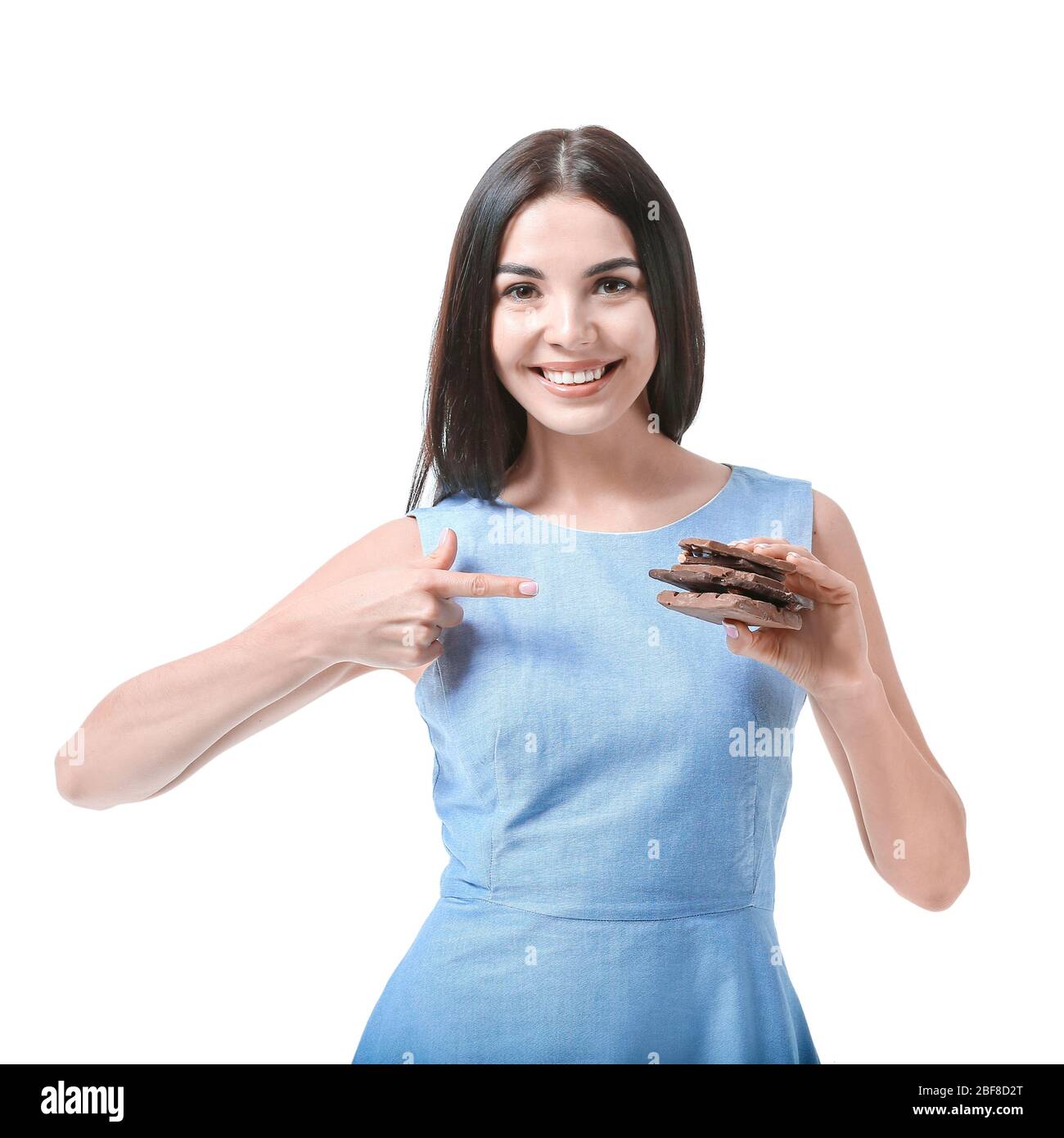 Beautiful young woman with chocolate on white background Stock Photo ...