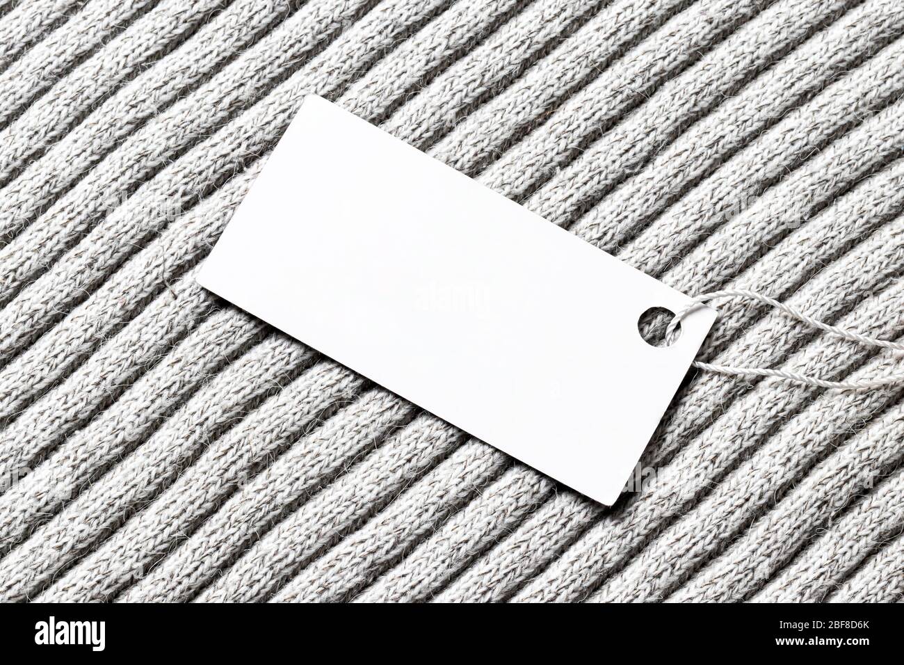White label on a woolen fabric. Abstract background for design. Art ...