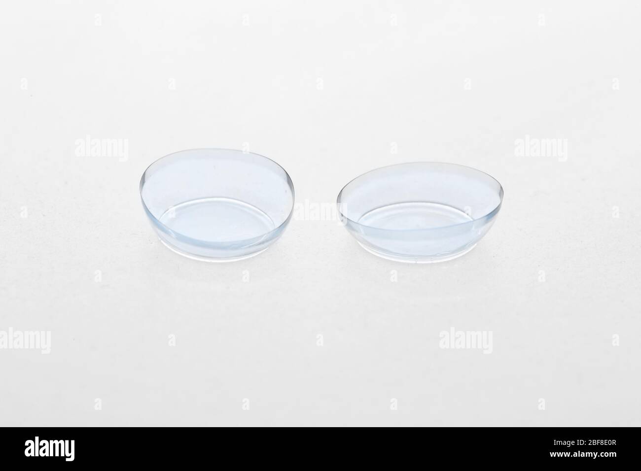 Contact lenses on white background Stock Photo - Alamy