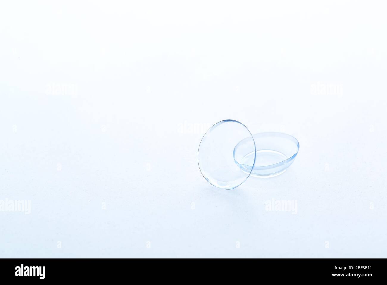 Contact lenses on white background Stock Photo - Alamy