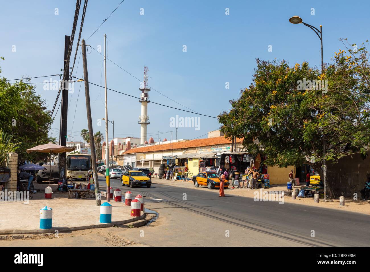DAKAR, SENEGAL - NOVEMBER 11, 2019: People working and traffic at ...
