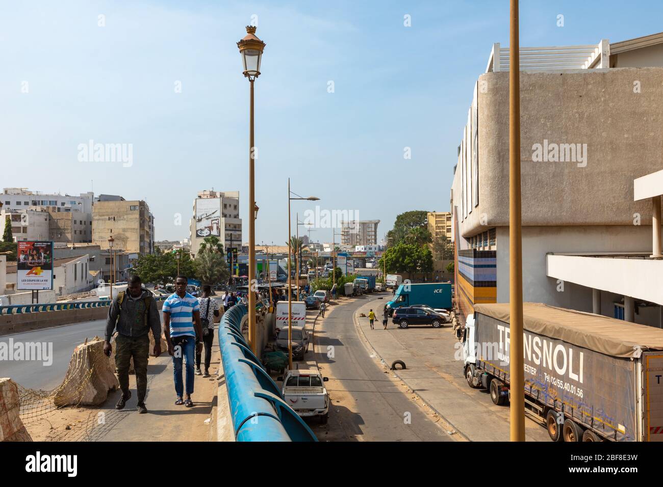 DAKAR, SENEGAL - NOVEMBER 11, 2019: People working and traffic at ...
