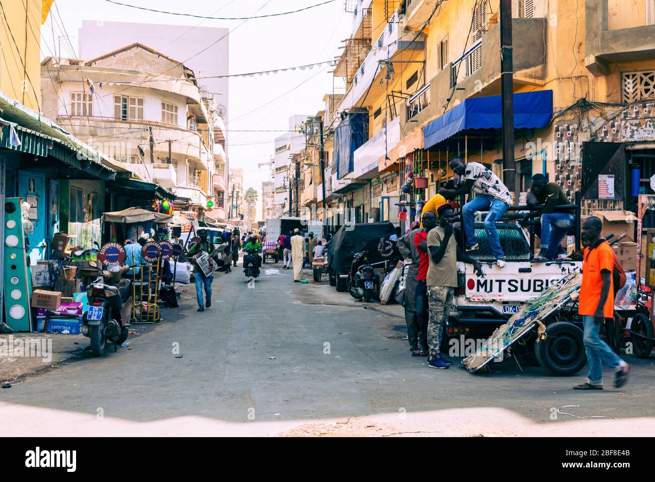 DAKAR, SENEGAL - NOVEMBER 11, 2019: People working and traffic at ...