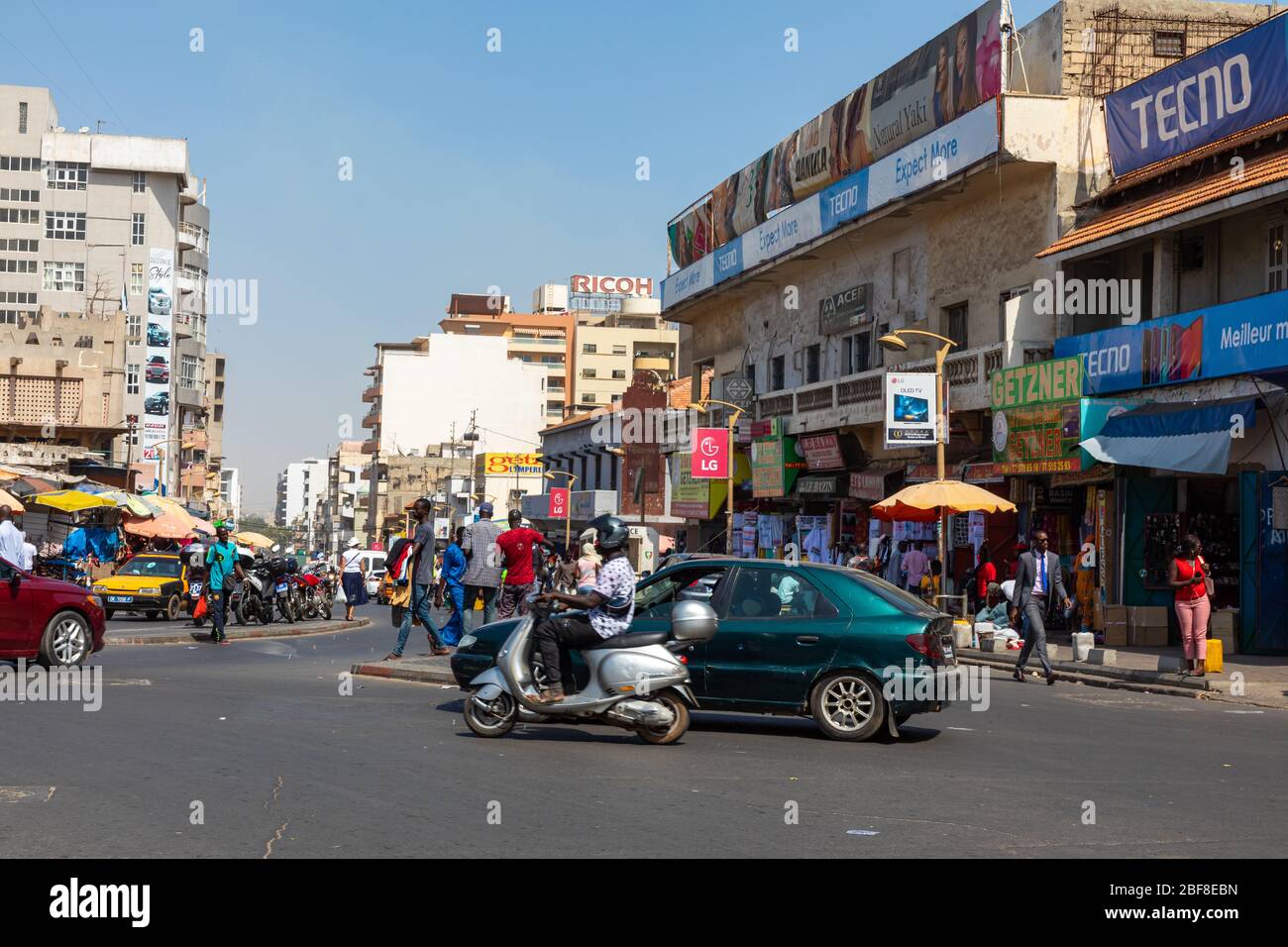 DAKAR, SENEGAL - NOVEMBER 11, 2019: People working and traffic at ...