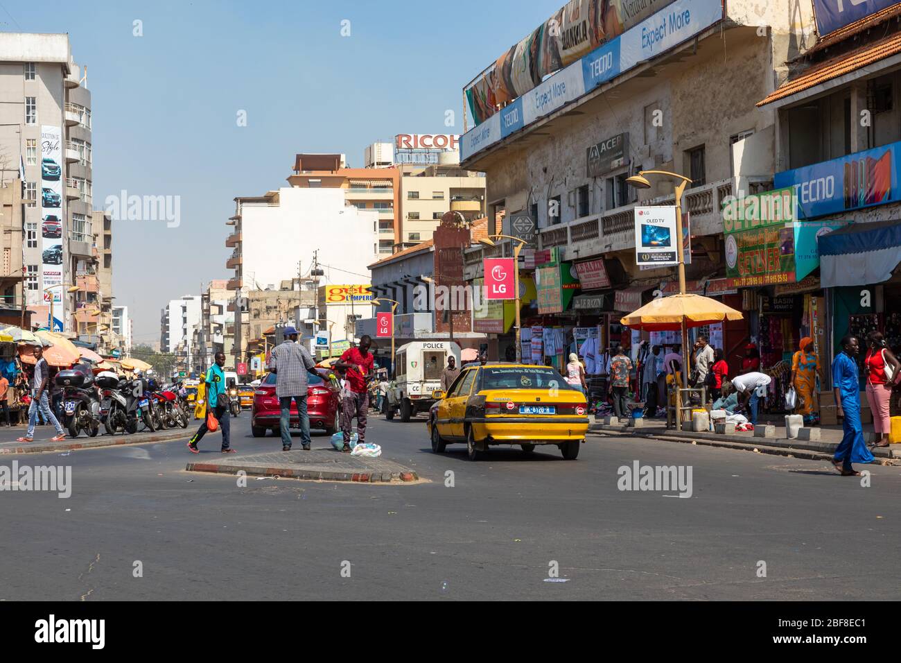 DAKAR, SENEGAL - NOVEMBER 11, 2019: People working and traffic at ...
