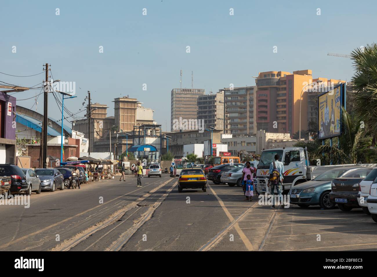 DAKAR, SENEGAL - NOVEMBER 11, 2019: People working and traffic at ...
