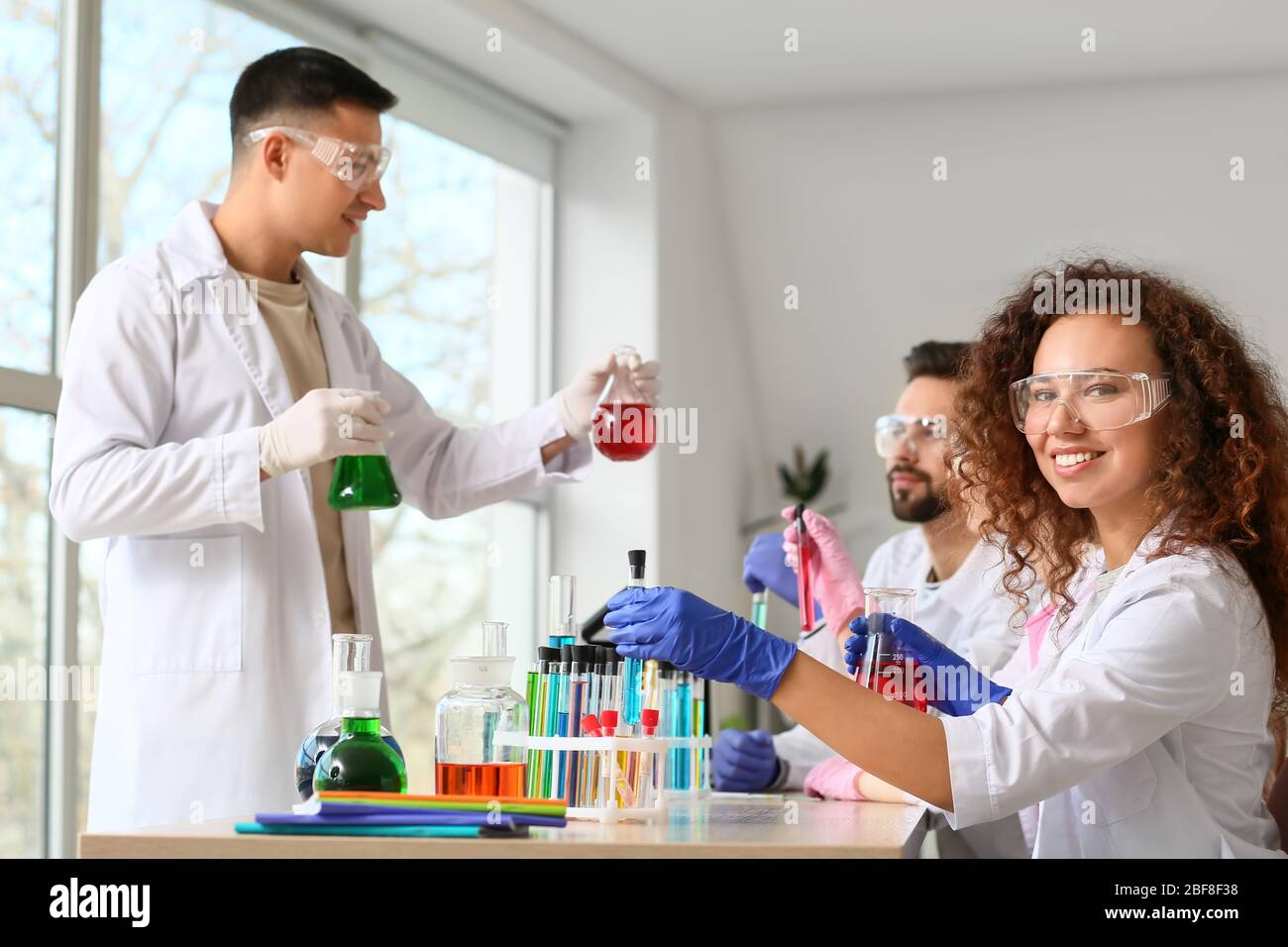 Teacher conducting chemistry lesson in classroom Stock Photo - Alamy