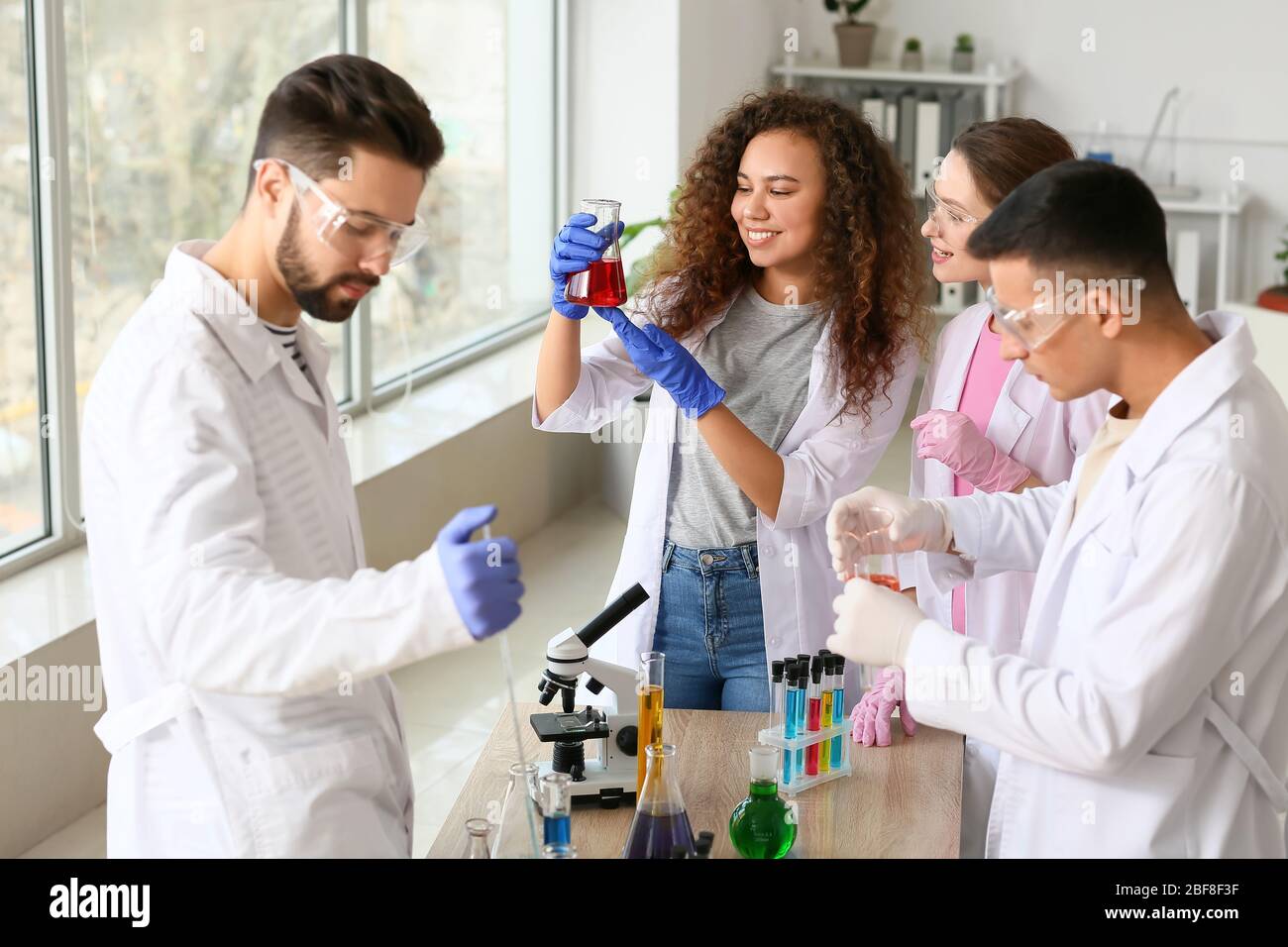 Young people at chemistry lesson in classroom Stock Photo - Alamy