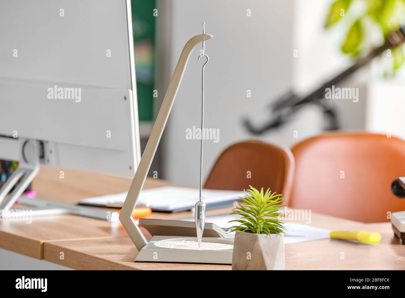 Pendulum on table in classroom Stock Photo - Alamy
