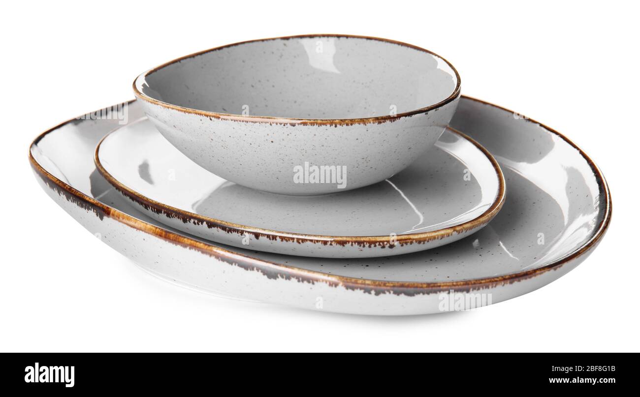 Clean plates on white background Stock Photo - Alamy