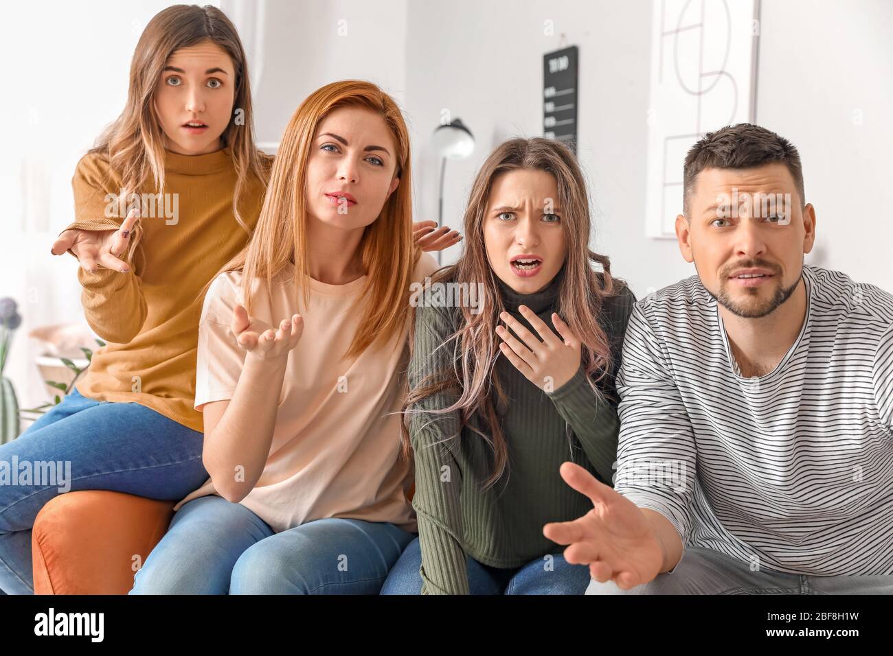 Emotional friends using video chat at home Stock Photo - Alamy