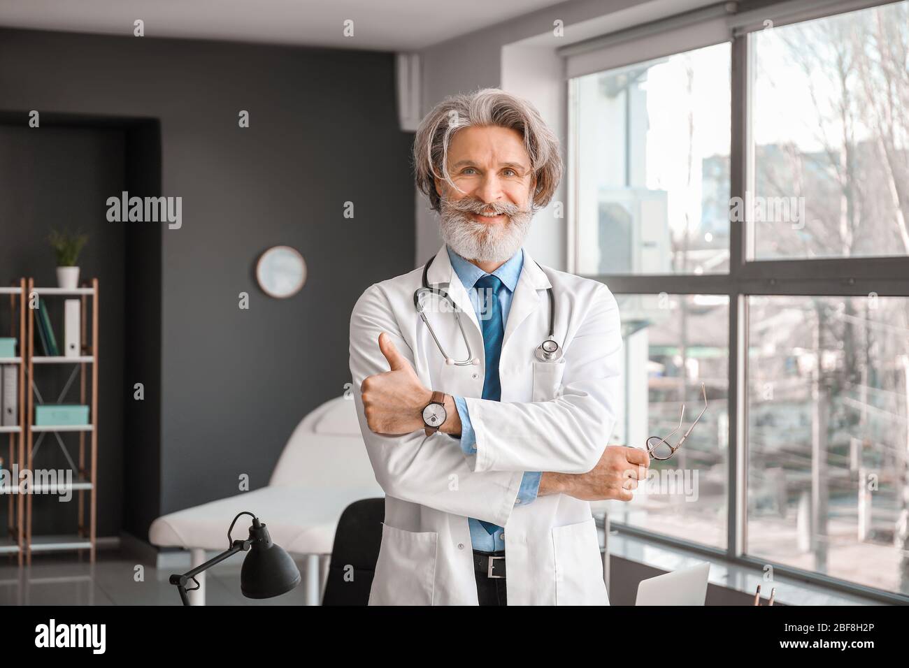 Handsome elderly doctor in uniform hi-res stock photography and images ...