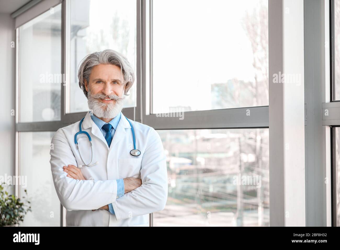 Handsome elderly doctor in uniform hi-res stock photography and images ...