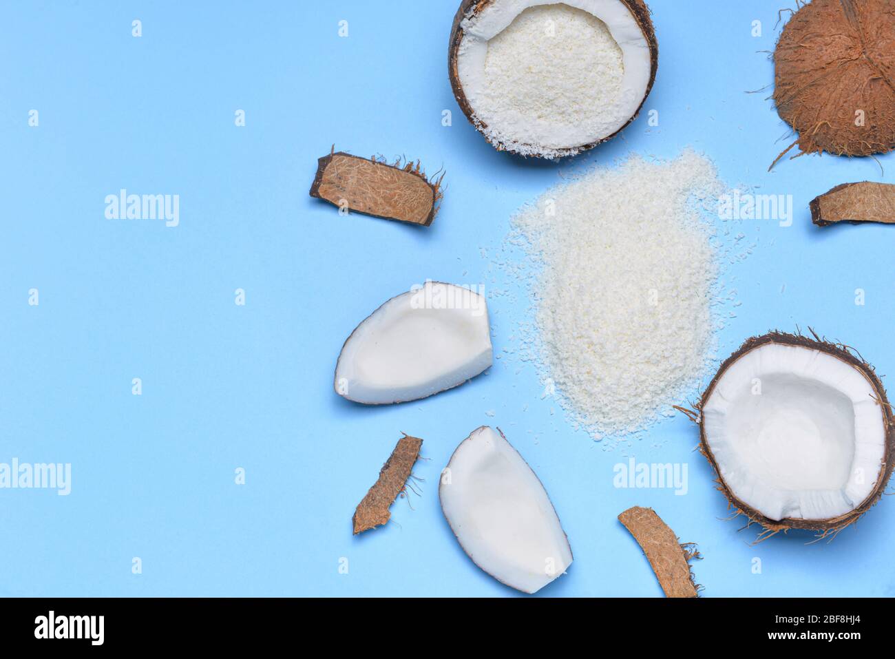 Composition with ripe coconuts on color background Stock Photo - Alamy