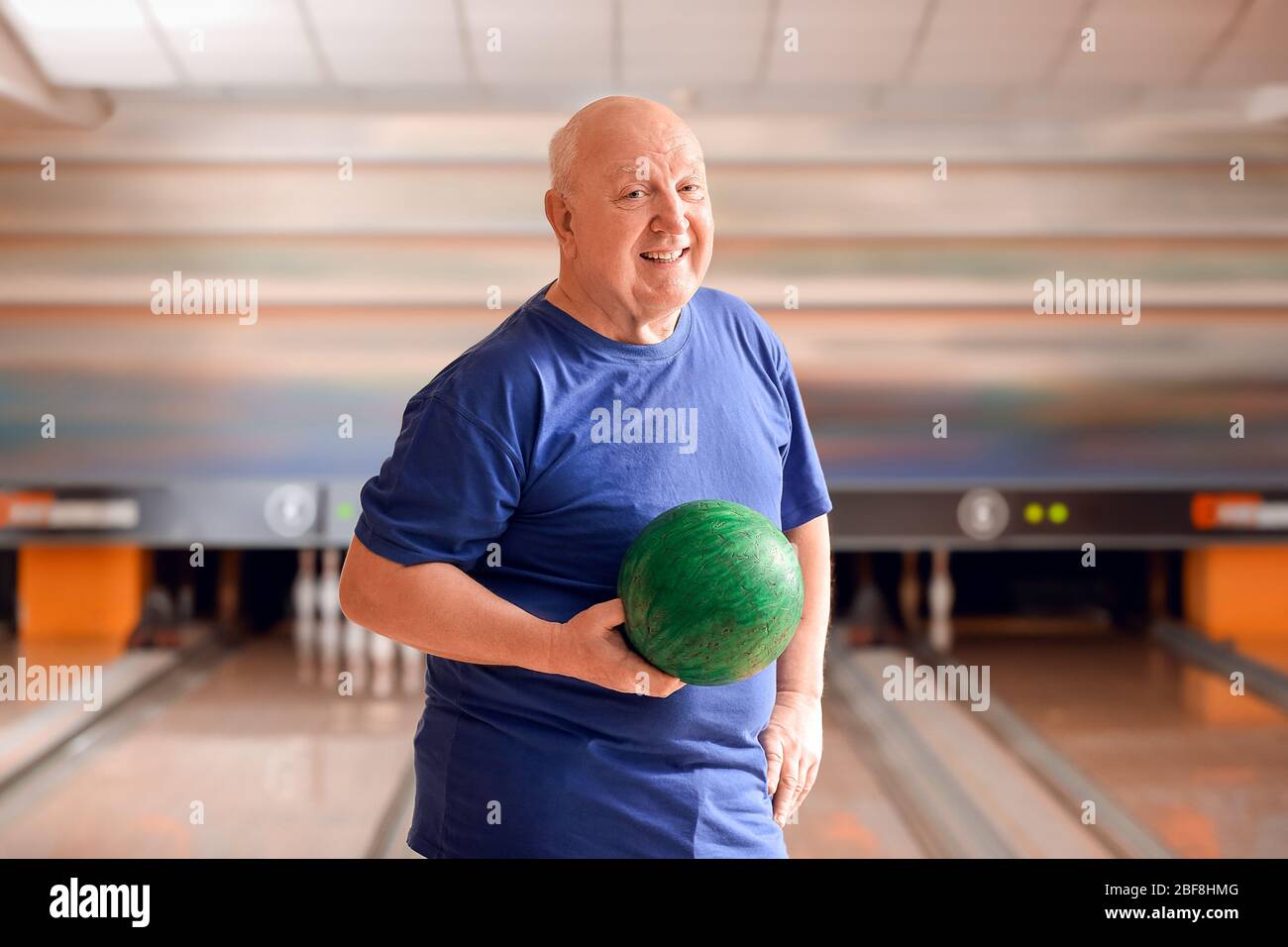 Portrait of senior man in bowling club Stock Photo - Alamy