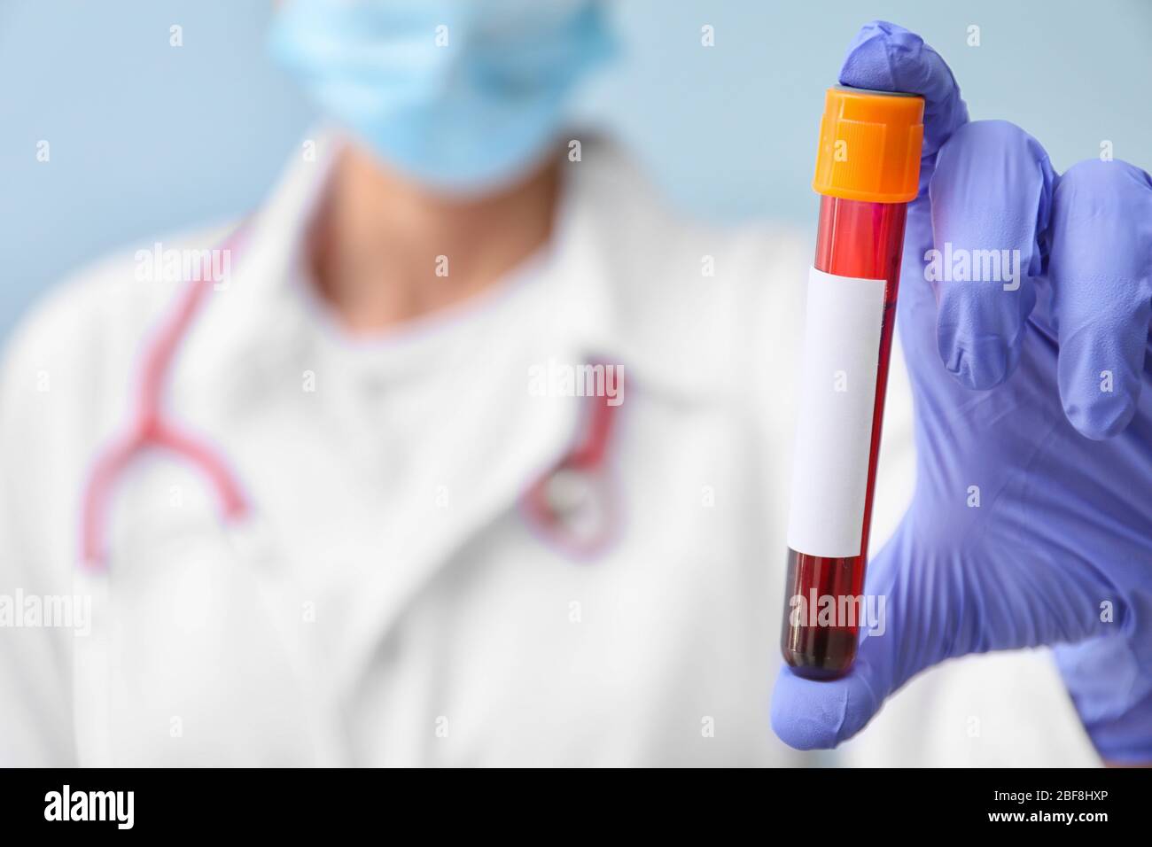 Female doctor holding blood sample in test tube, closeup Stock Photo ...