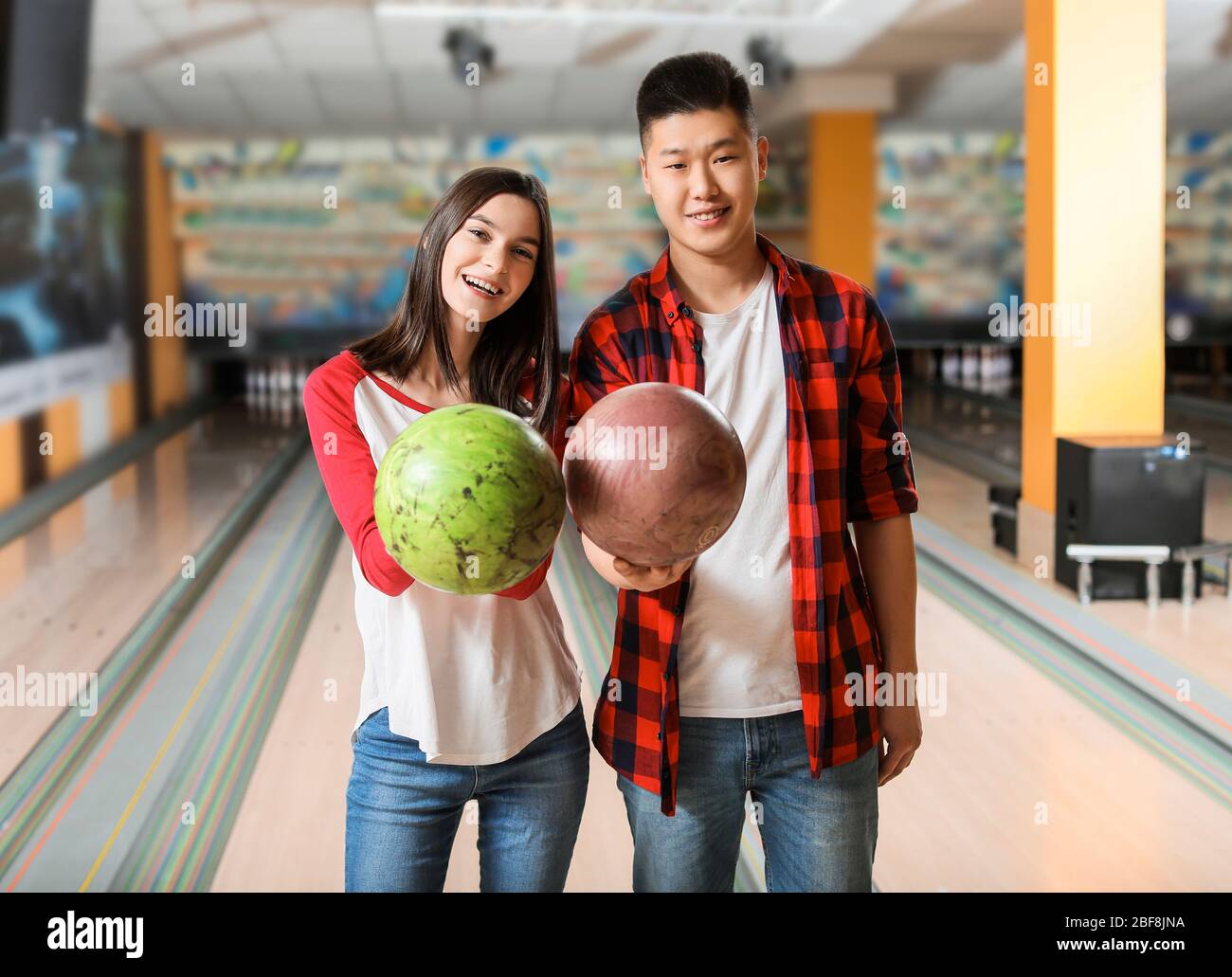 Portrait of friends in bowling club Stock Photo - Alamy