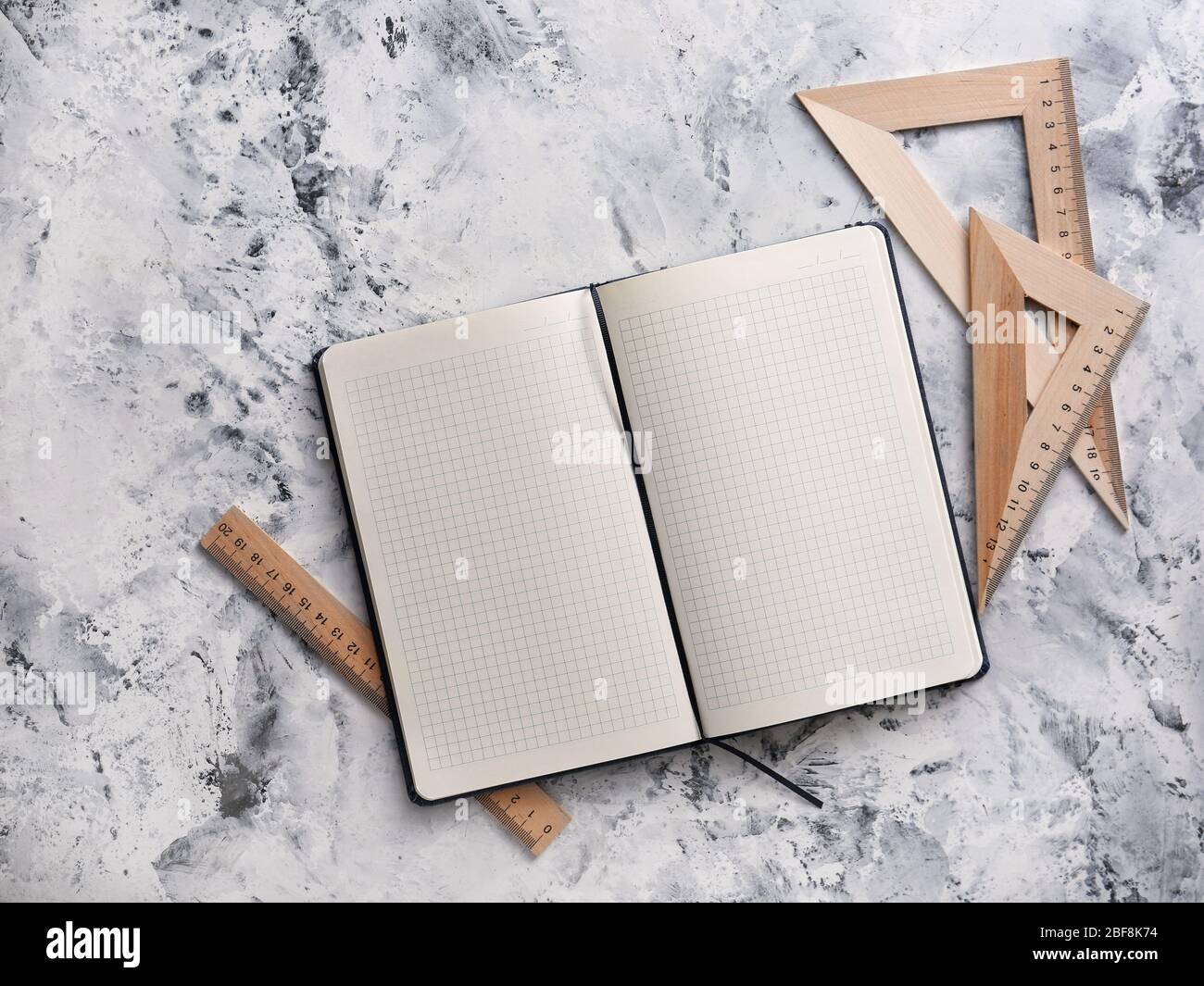 Notebook with rulers on white background Stock Photo - Alamy