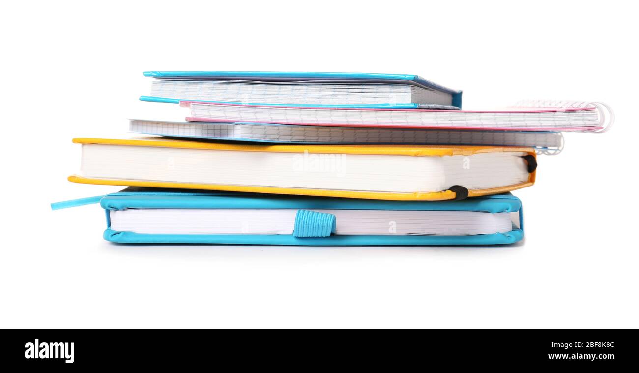 Stack of notebooks on white background Stock Photo - Alamy