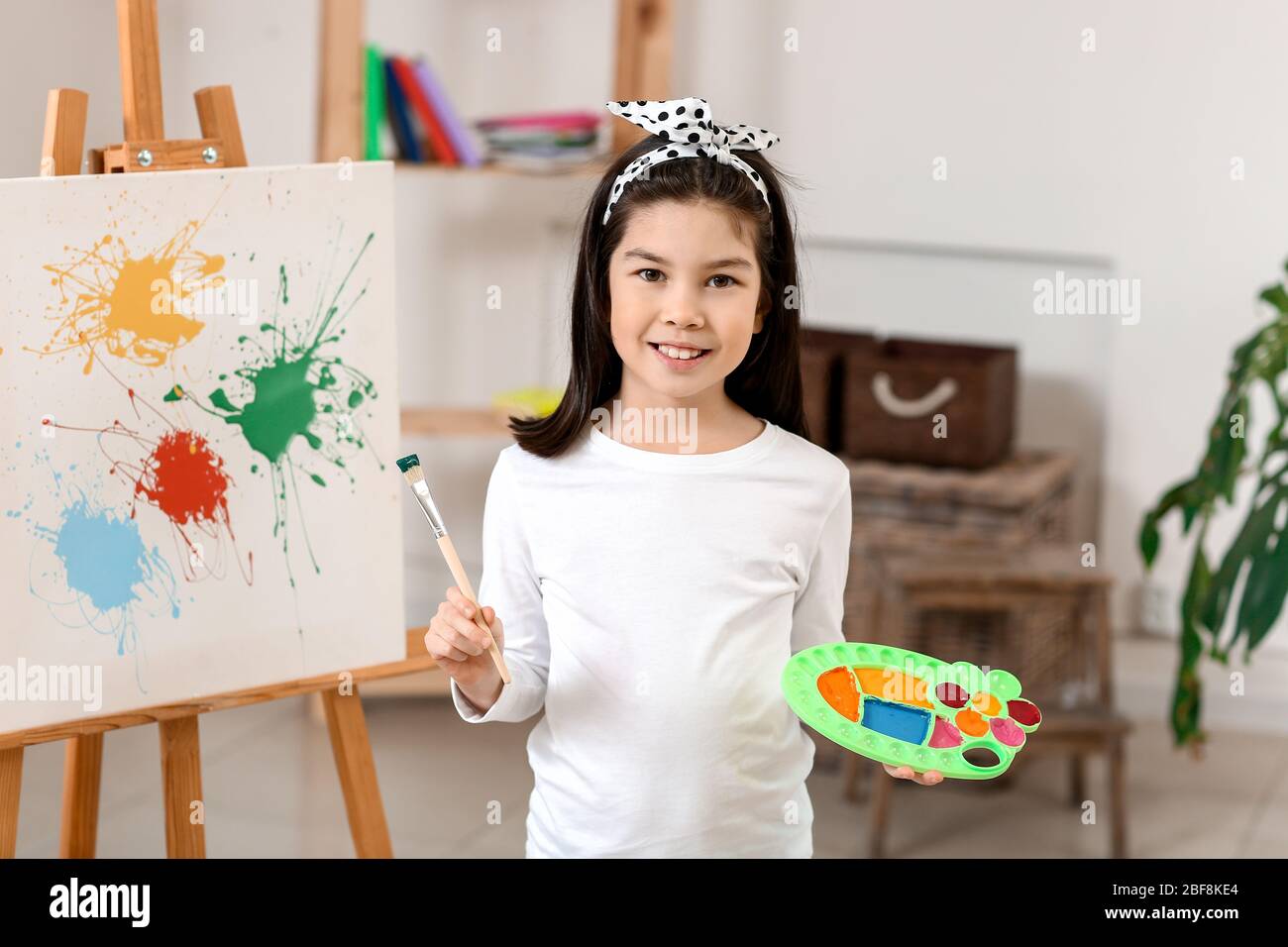 Cute little artist painting at home Stock Photo - Alamy