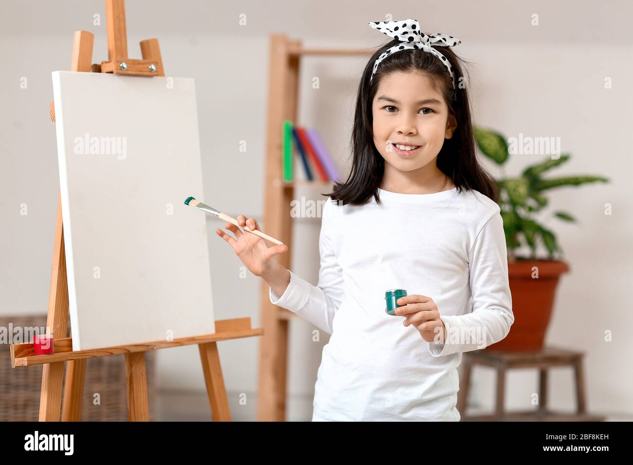 Cute little artist painting at home Stock Photo - Alamy