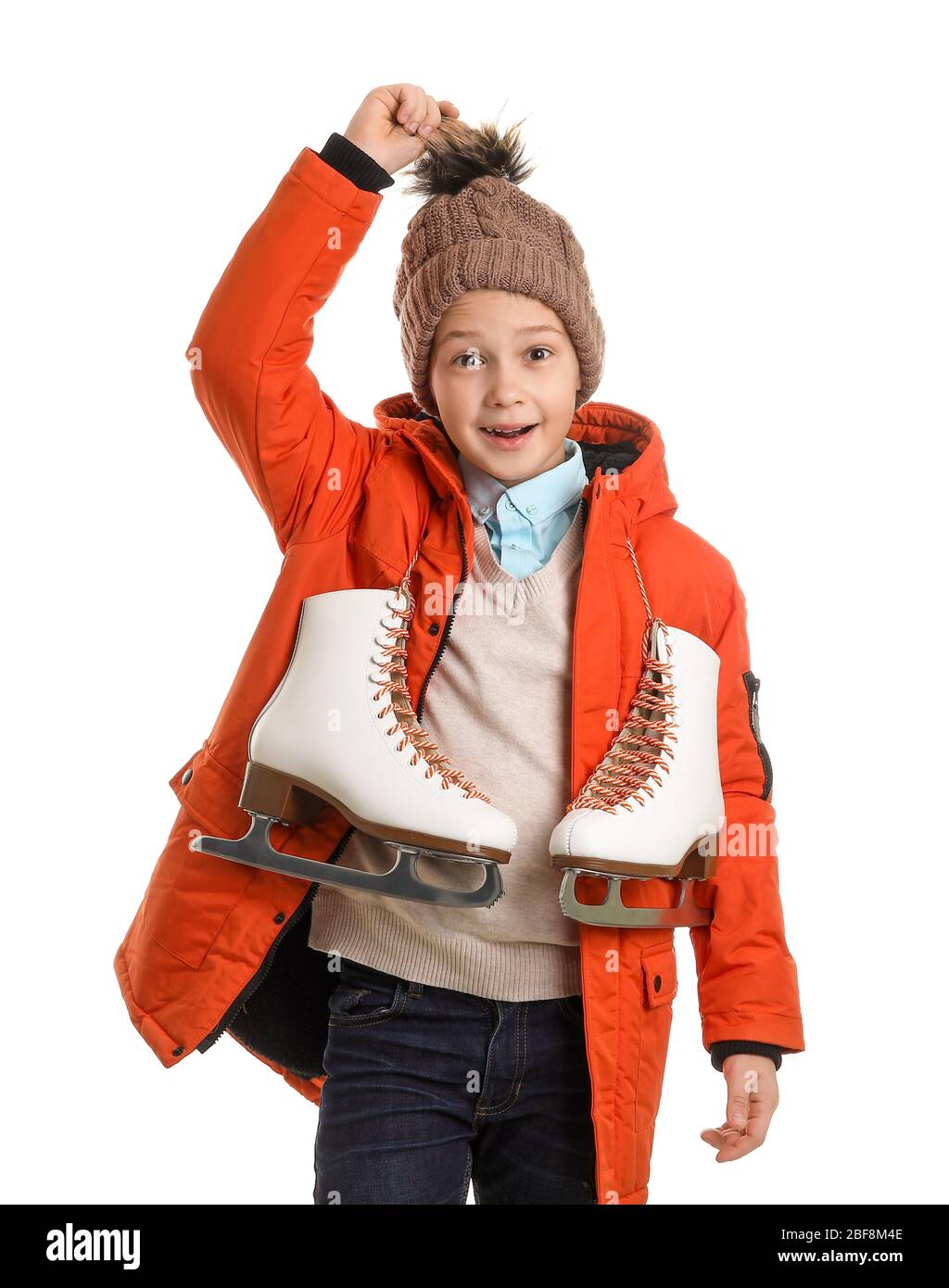 Cute little boy with ice skates against white background Stock Photo ...
