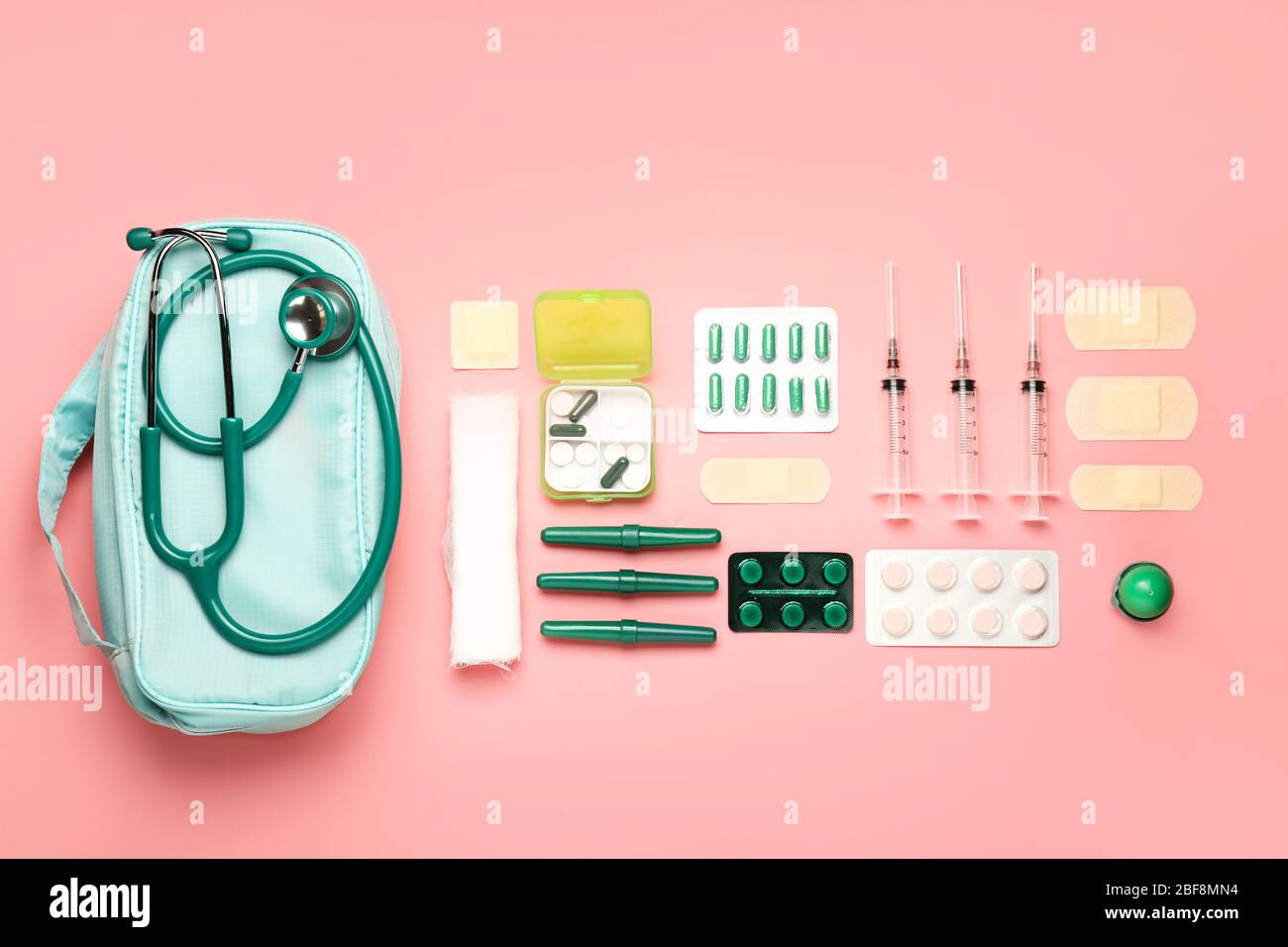 First aid kit on color background Stock Photo - Alamy
