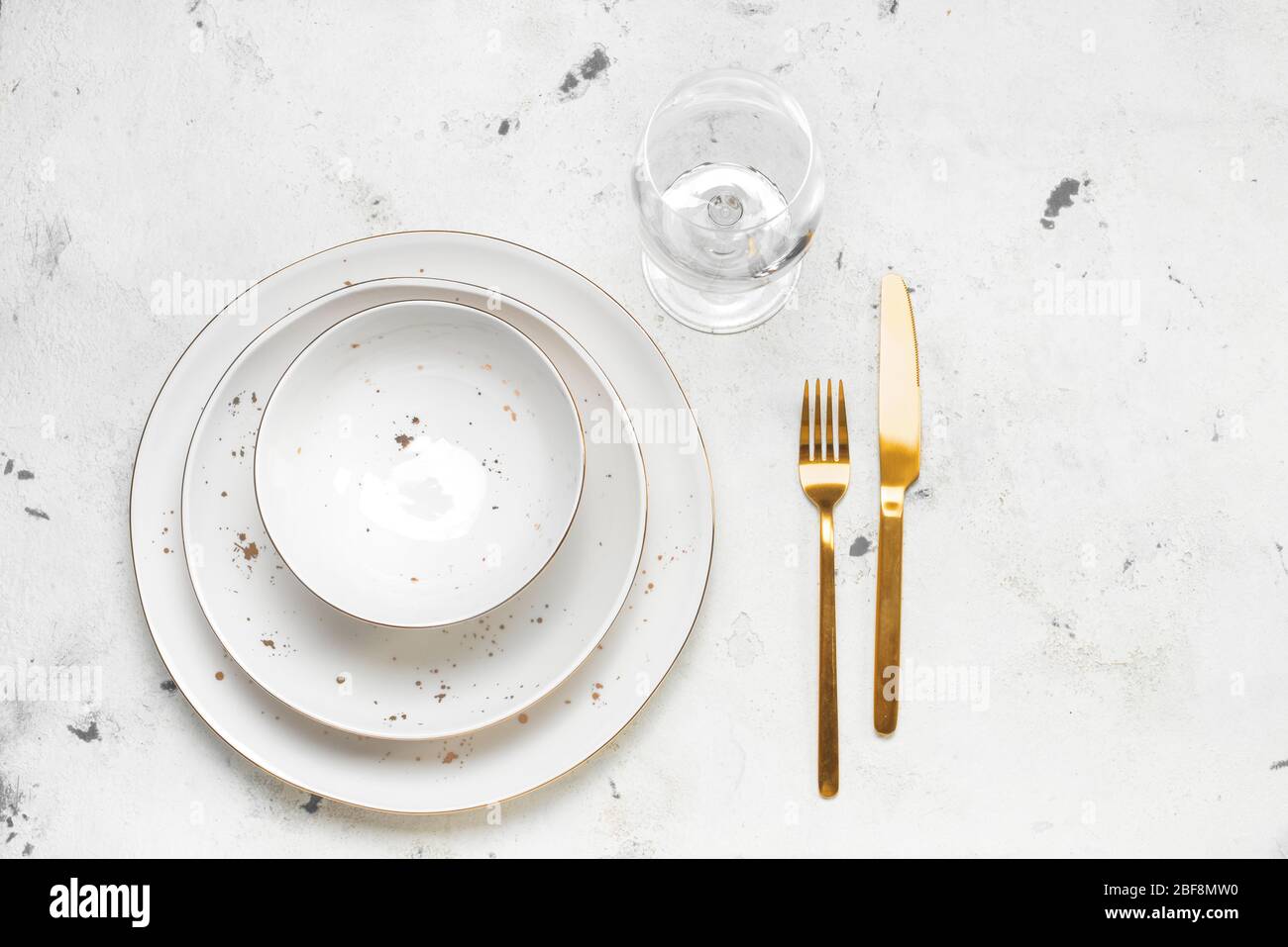 Simple table setting on white background Stock Photo - Alamy