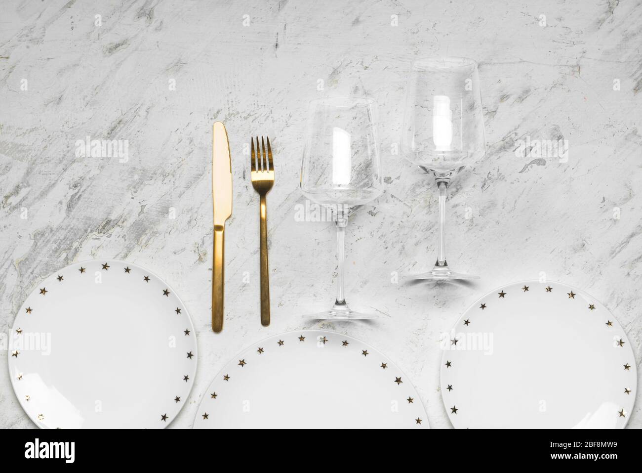 Simple table setting on white background Stock Photo - Alamy