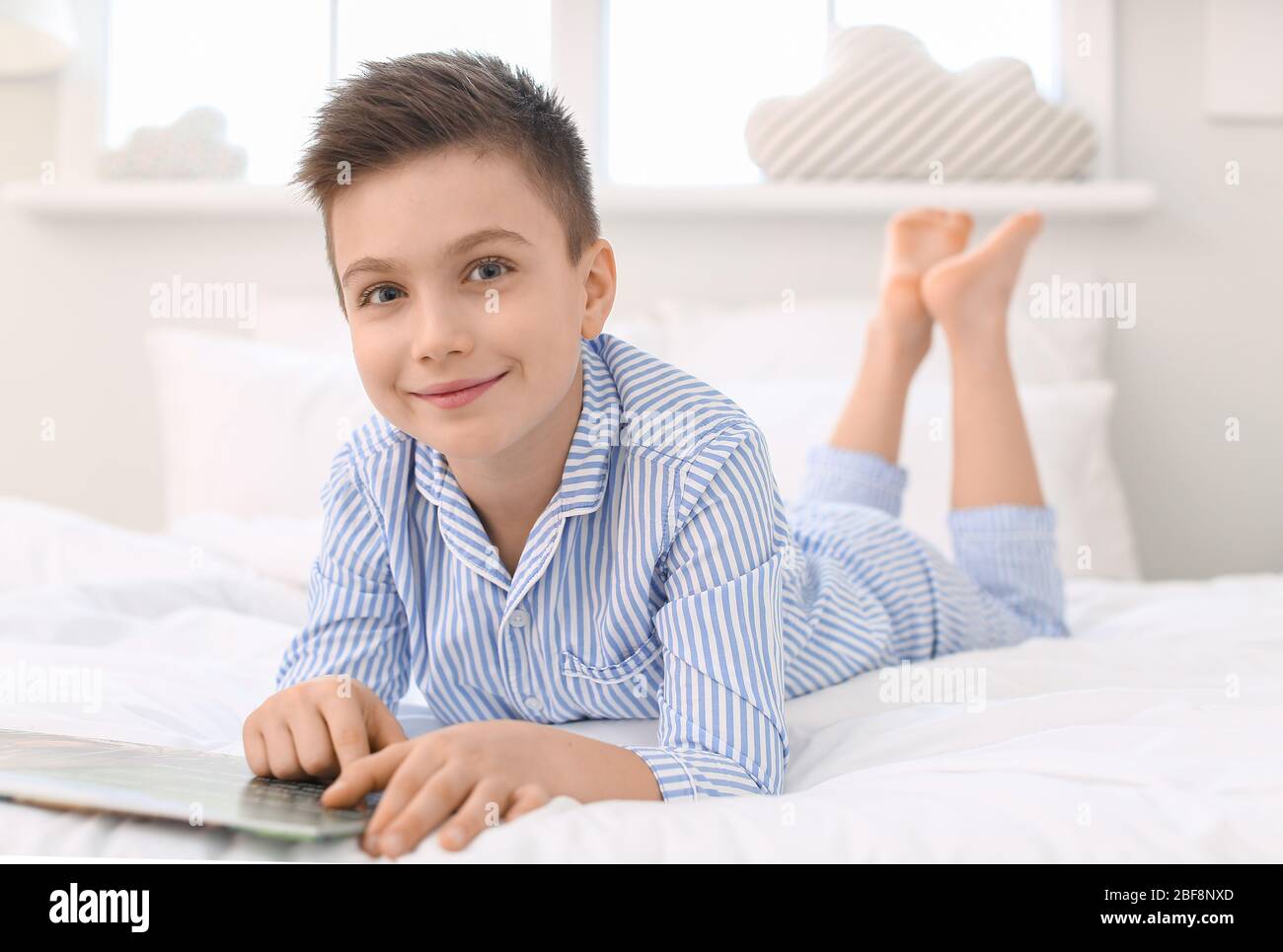 Cute little boy reading bedtime story at home Stock Photo - Alamy