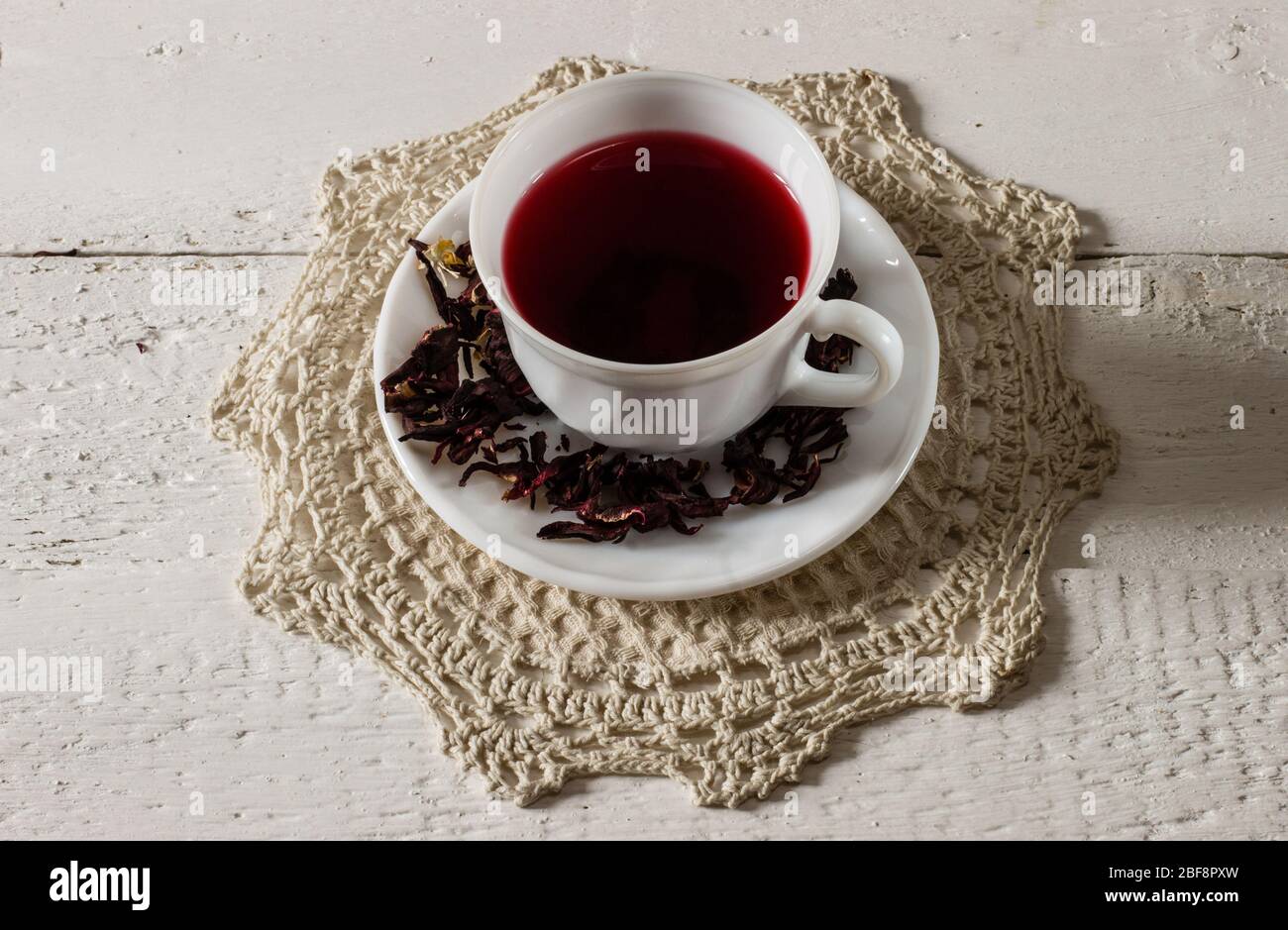 Cup of Karkadeh Red Tea with Dry Flowers Stock Photo - Alamy