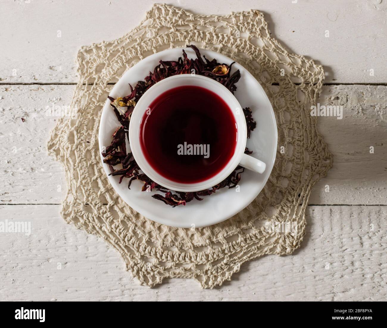 Cup of Karkadeh Red Tea with Dry Flowers Stock Photo - Alamy