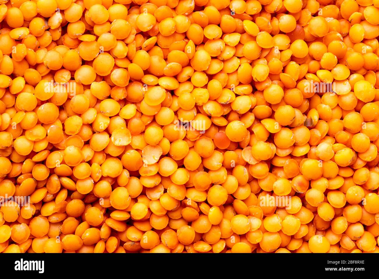 Close up red lentil seeds background. Healthy vegeterian food. Texture ...