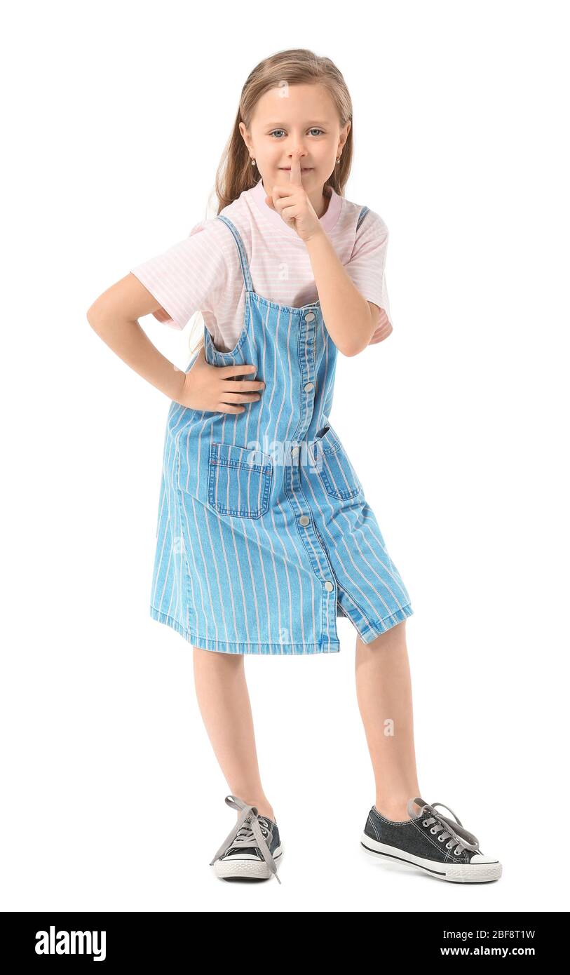 Cute little girl showing silence gesture on white background Stock ...