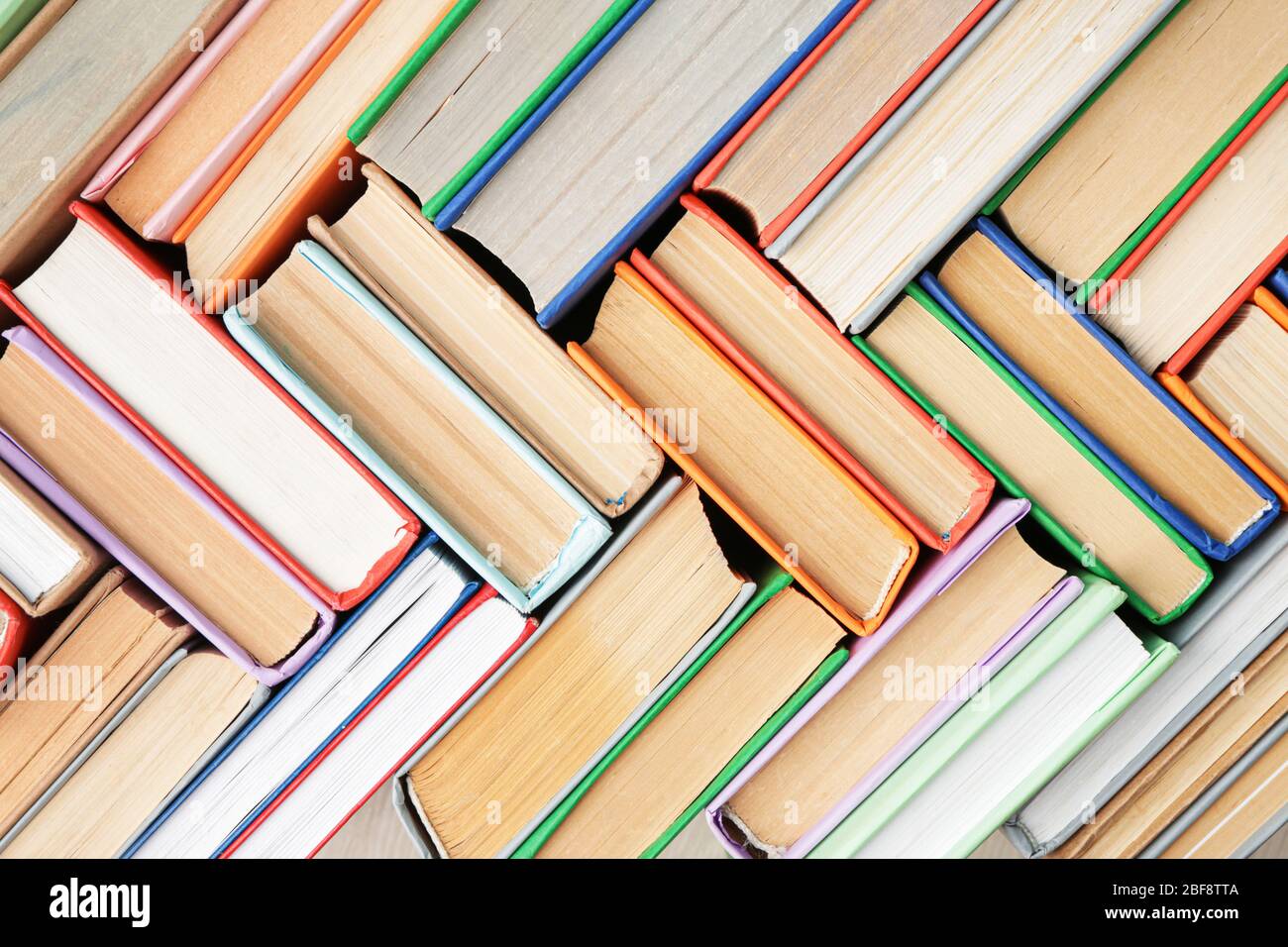Many different books as background Stock Photo - Alamy