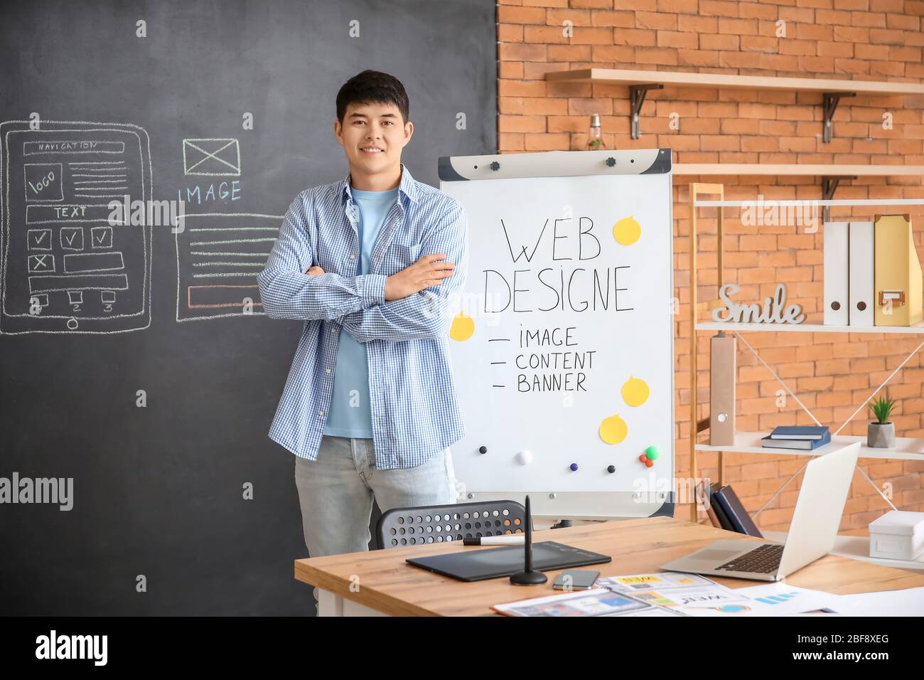 Portrait of male IT designer in office Stock Photo - Alamy