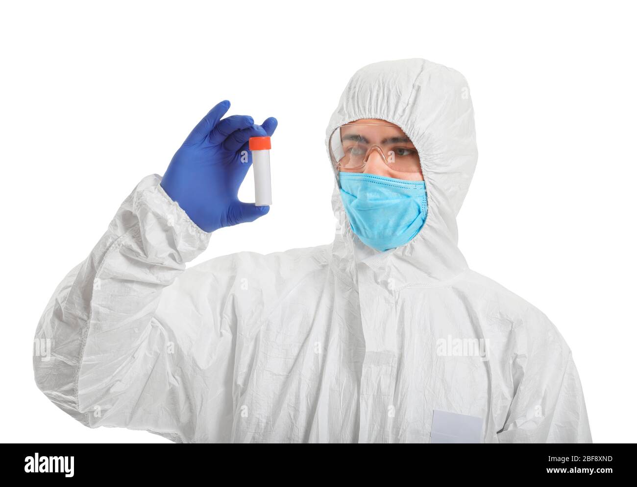 Laboratory worker in protective uniform holding test tube with sample ...