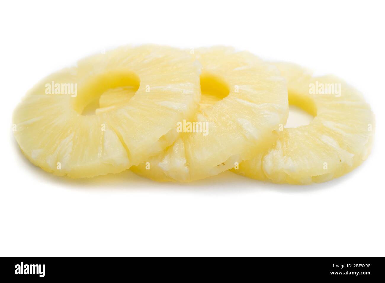 Pineapple rings isolated on white background Stock Photo - Alamy